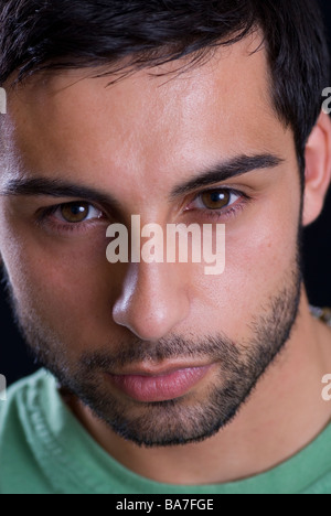 Young 30s arab bearded man millennial guy in glasses sits at home on ...