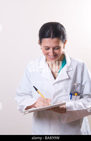 GP Doctor writing prescription. UK Stock Photo - Alamy