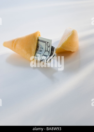 Fortune cookie with money Stock Photo - Alamy