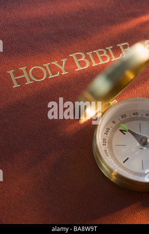 Bible with compass Stock Photo - Alamy