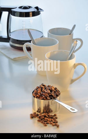 Cups of coffee on color background Stock Photo - Alamy