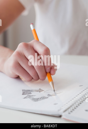 Colour pencil with a drawing of the recycling symbol on a piece of ...