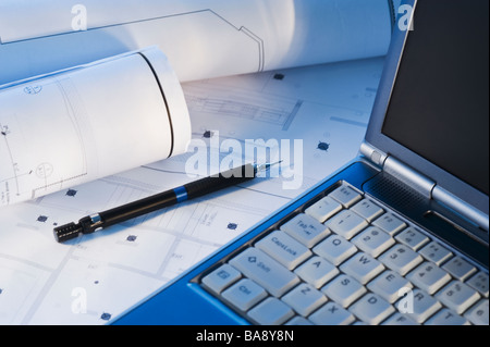 Blueprints, pen and laptop Stock Photo - Alamy