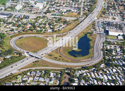 Aerial view of american freeway intersection with fast moving cars and ...