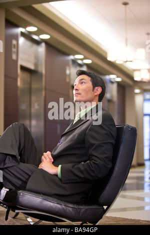Close-up of a Asian businessman thinking Stock Photo - Alamy