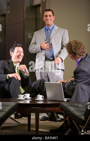 Business colleagues laughing Stock Photo - Alamy