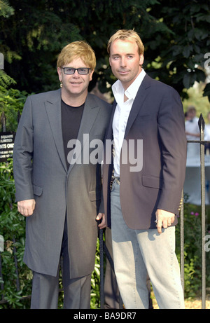 Sir Elton John and partner David Furnish appear delighted as they pose ...
