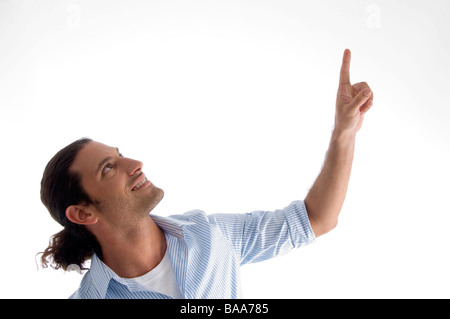 cool young guy pointing upwards Stock Photo - Alamy