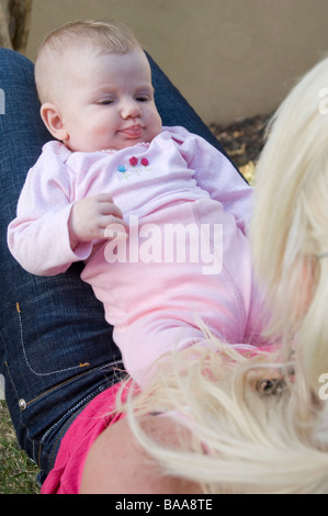 Childhood, family and infant concept - Little baby girl on windowsill ...