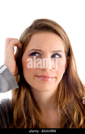 Pretty girl scratching face in outdoor park. Woman scratches lip ...