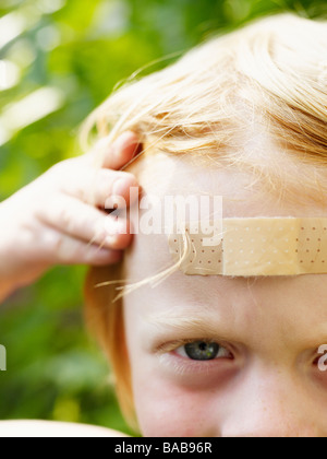 Boy, forehead, plaster, close up, person, child, injury, sore supply ...