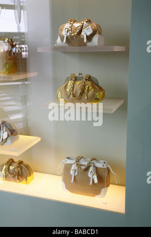 Prada bags in a shop window Stock Photo - Alamy