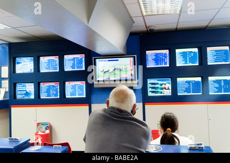 Screens inside a William Hill bookmakers London England UK Stock Photo ...
