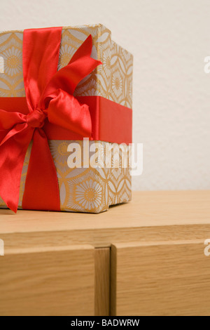 Close up of Cristmas present box with some colorful papper and toys ...