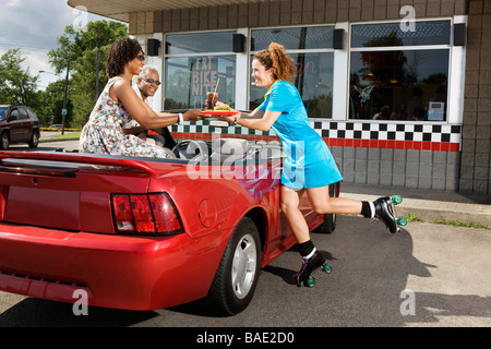 WAITRESS ON ROLLER SKATES AT DRIVE IN RESTAURANT MODESTO Stock Photo ...