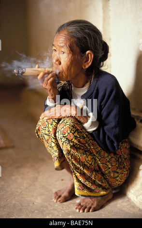 Myanmar (Burma), woman smoking a cheeroot, Burmese traditional cigar ...