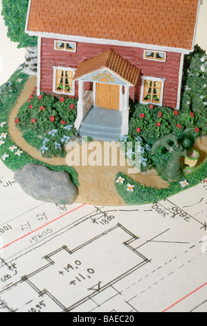 Toy house on a floorplan Stock Photo - Alamy