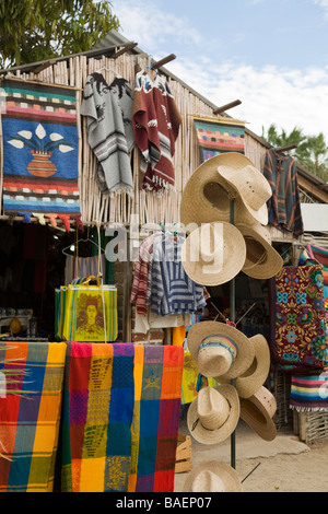 MEXICO Todos Santos Straw hats hanging on display stand in retail store ...