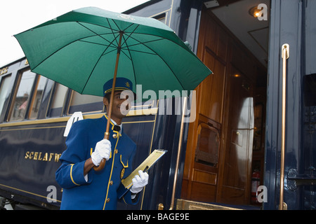 Czech Republic, Prague steward helps passengers to aboard the Orient ...