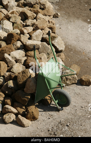 one green wheelbarrow at archaeological site Stock Photo - Alamy