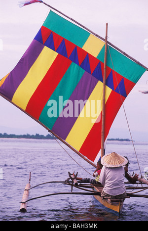 Sulu Sea Muslim vinta outrigger boat Colourful sail Two men ZAMBOANGA ...