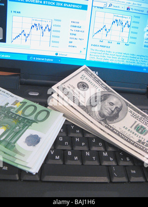 Cash money notebook with stock graphics Stock Photo - Alamy