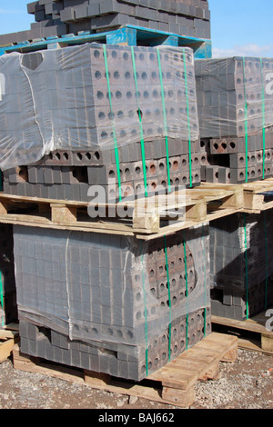 Stacked pallets of bricks on a building site Stock Photo - Alamy