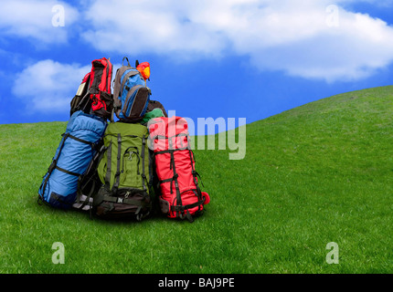 pile of colorful backpacks and camping gear neatly stacked, preparing ...