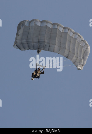 Male skydiver steering parachute Stock Photo - Alamy