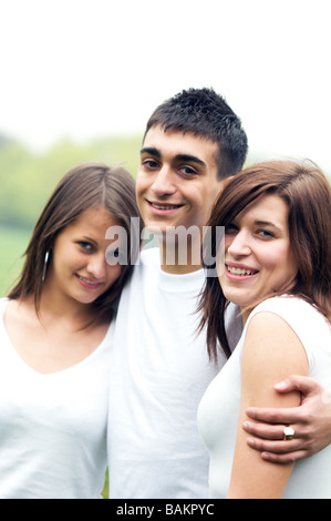 Happy smiling young people standing with their arms cropped Stock Photo ...