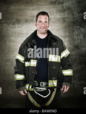 Portrait of a firefighter smiling Stock Photo - Alamy