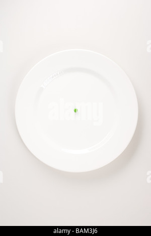 A single pea on a plate Stock Photo - Alamy