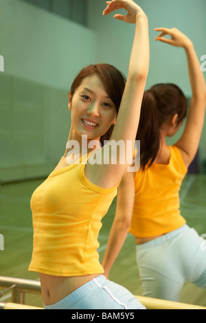 young Asian women stretch arm relax morning waking up sitting on living ...