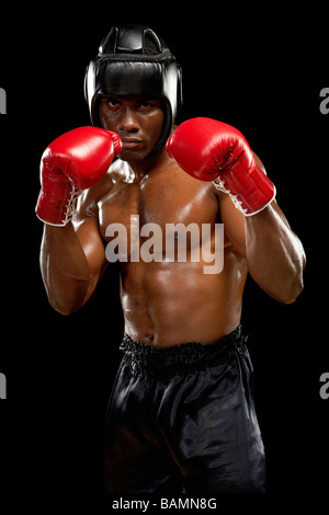 Boxer with raised fists, portrait Stock Photo - Alamy