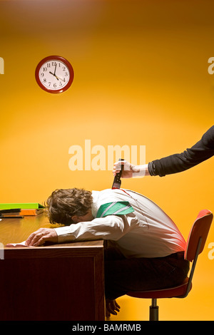 Stabbed in the back at the office Stock Photo - Alamy