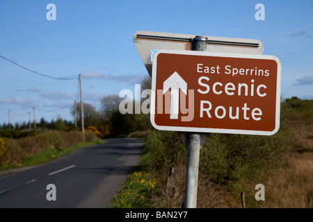 crooked signpost for the east sperrins scenic tourist route on a small ...