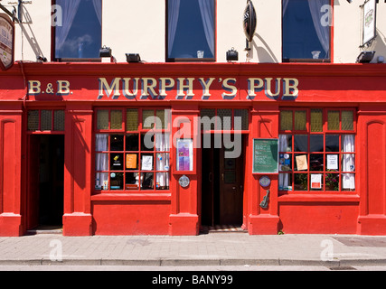 Traditional Irish Shop fronts and pub Murphys Irish Stout signs in the ...