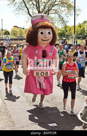 Fancy dress Giant Nurse runner in the London Marathon 2022 at Narrow ...