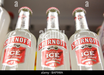 Bottles of Smirnoff Ice on the shelf in an off license Stock Photo - Alamy