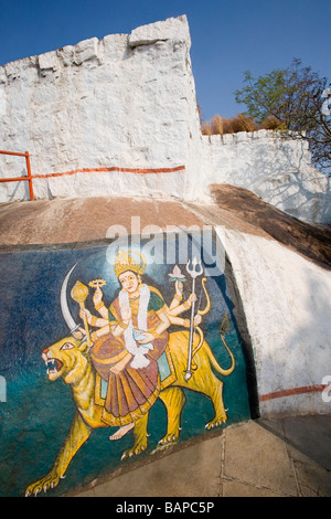 Painting of lord Durga on a rock in a fort, Golconda Fort, Hyderabad ...