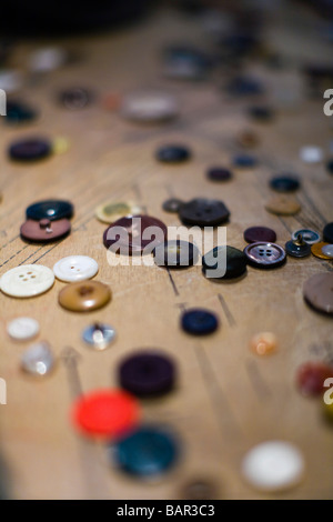 Buttons in many different colours, shapes, and sizes, view from above ...