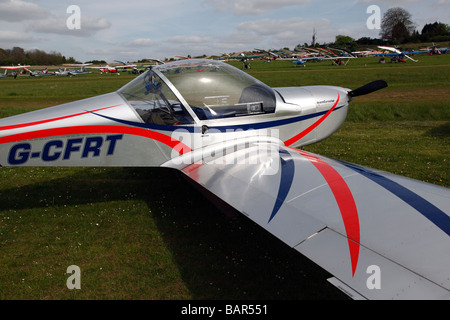 A microlight aircraft flying at Popham airfield in Hampshire in England ...