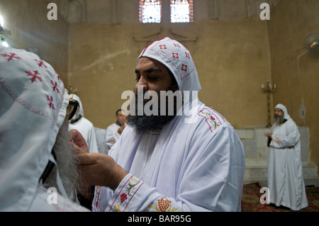 Coptic priests ritual process inside the Red Monastery Deir al Anba ...