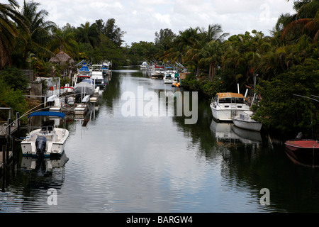 Florida Canal with boats moored Stock Photo - Alamy