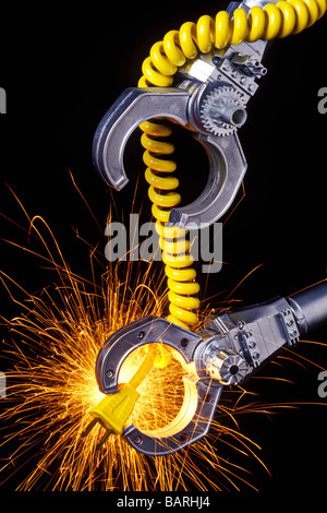 Close up of automatic robot arms in automotive industry, factory production of headlamps for a ...