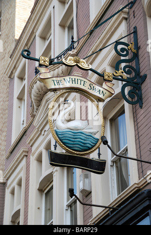 the white swan Pub sign Stock Photo - Alamy