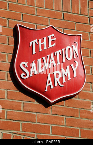The Red Shield logo of the Salvation Army on the brick wall of a church ...