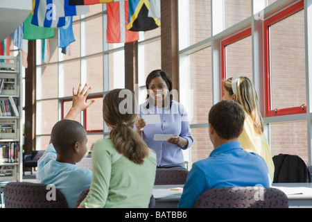 Teacher asking students questions Stock Photo - Alamy