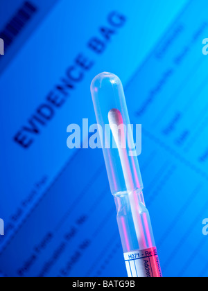 Forensic evidence. Swab sample from a crime sceneon top of a forensic ...