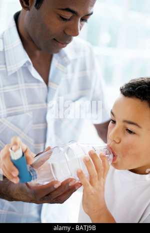 Adult son showing to his old father a family photo Stock Photo - Alamy